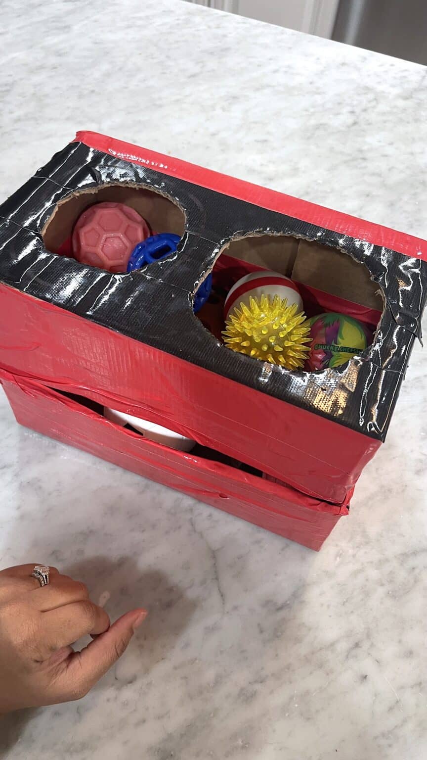 A Super Easy Baby Ball Drop Activity Your Child Will Love